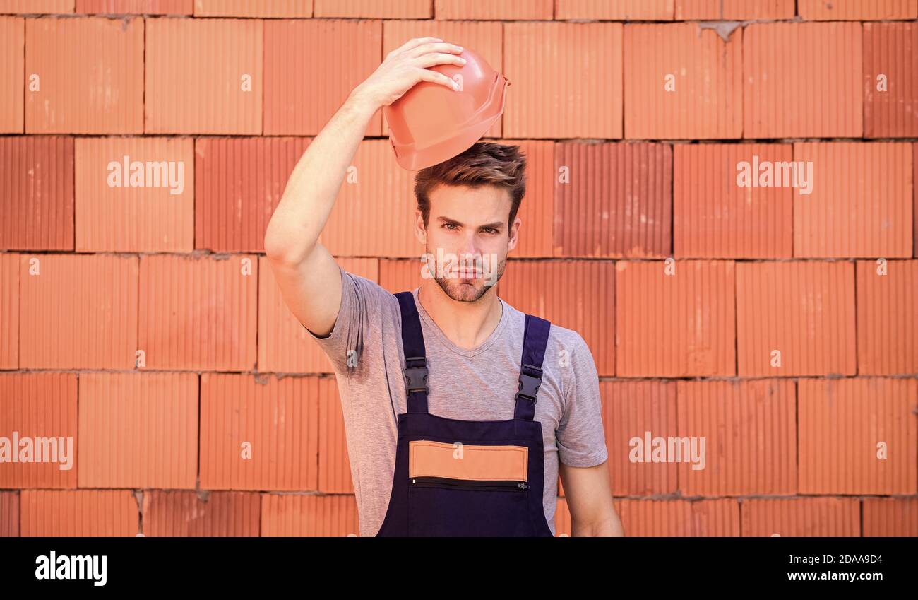 Worker brick wall background. Building construction. General ...