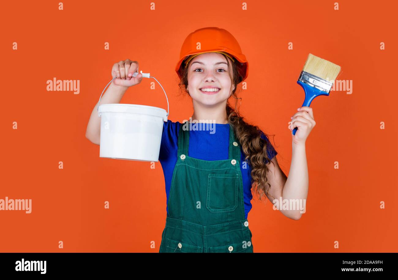 happy kid engineer with painting bucket and brush tool in hard hat ...