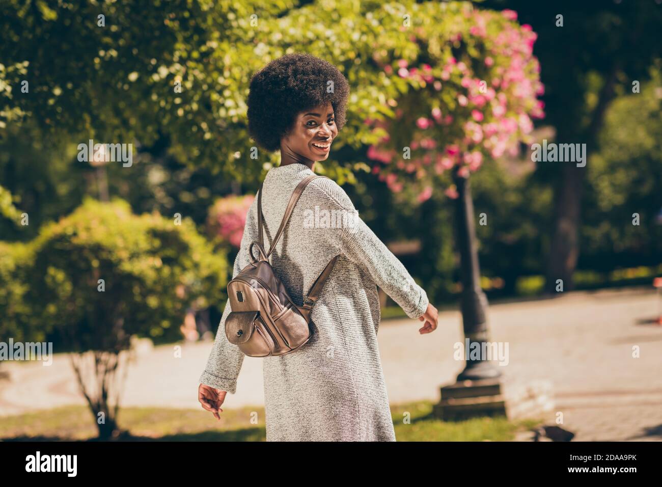 Back rear spine view photo of positive dark skin lady walk in summer ...