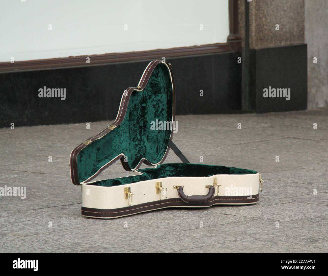 The Open Guitar Case of a Street Musician Stock Photo - Alamy