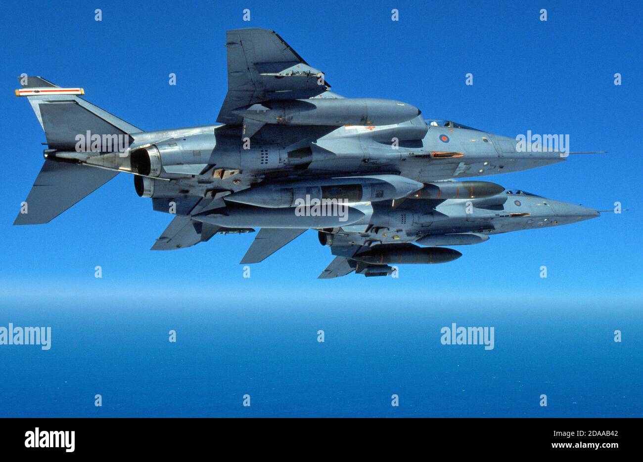 An air to air shot of two RAF SEPECAT Jaguar jet fighters banking over ...