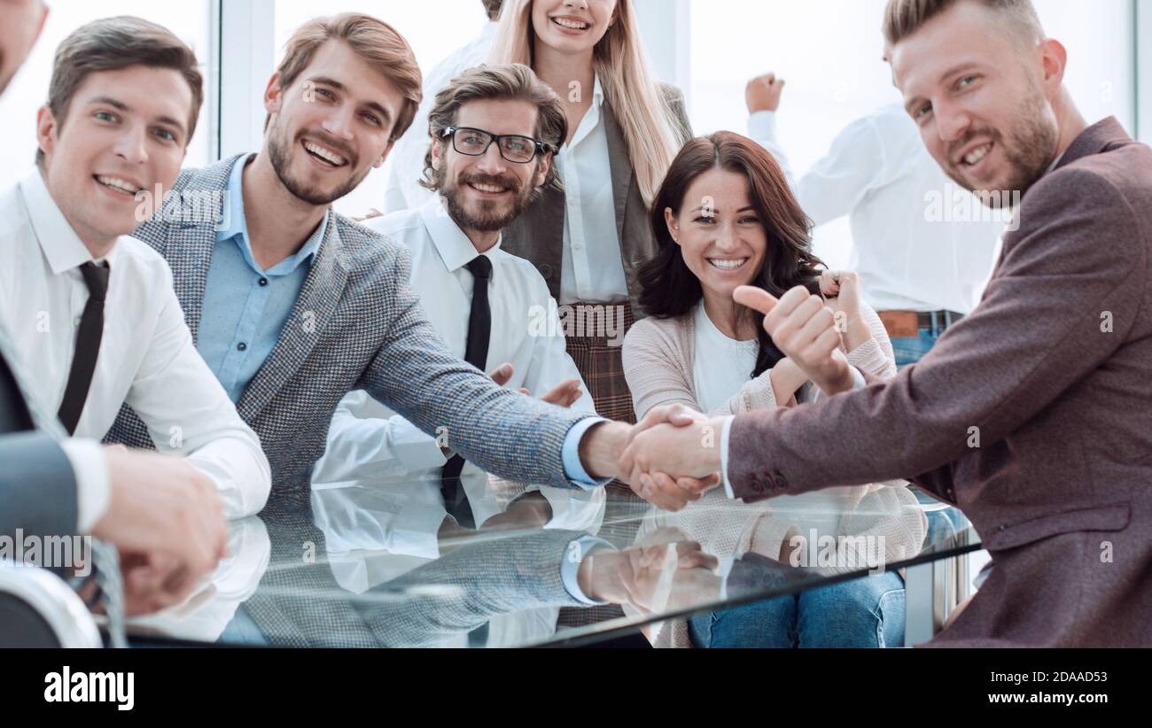 happy business people confirming the transaction with a handshake Stock ...