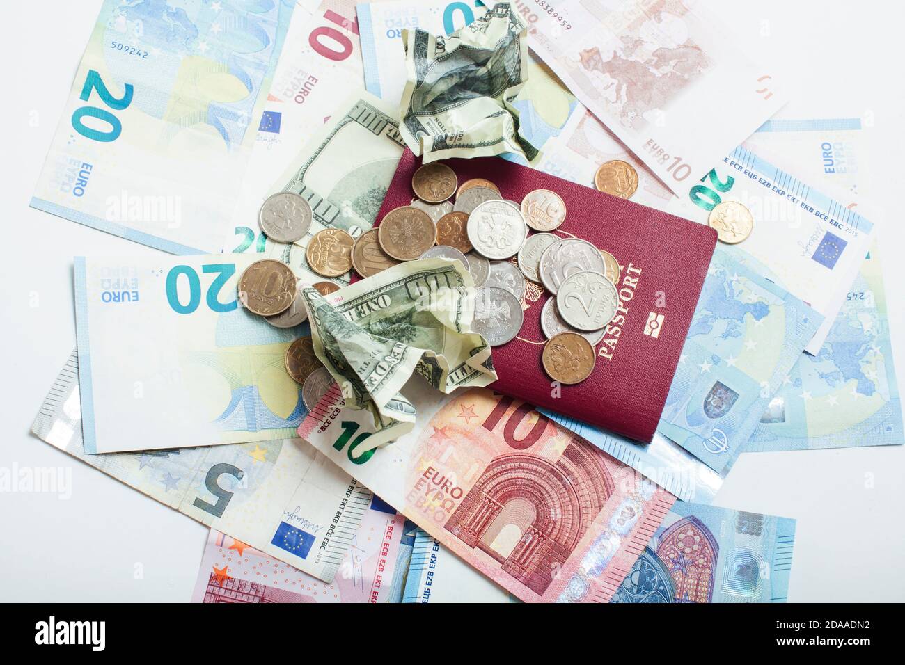 Cash on table isolated: dollars, euro, rubl broken money. All in mess ...