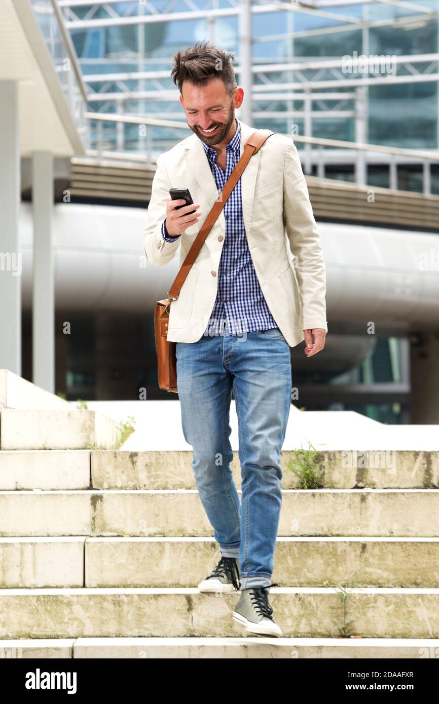 Smart man walking down steps hi-res stock photography and images - Alamy