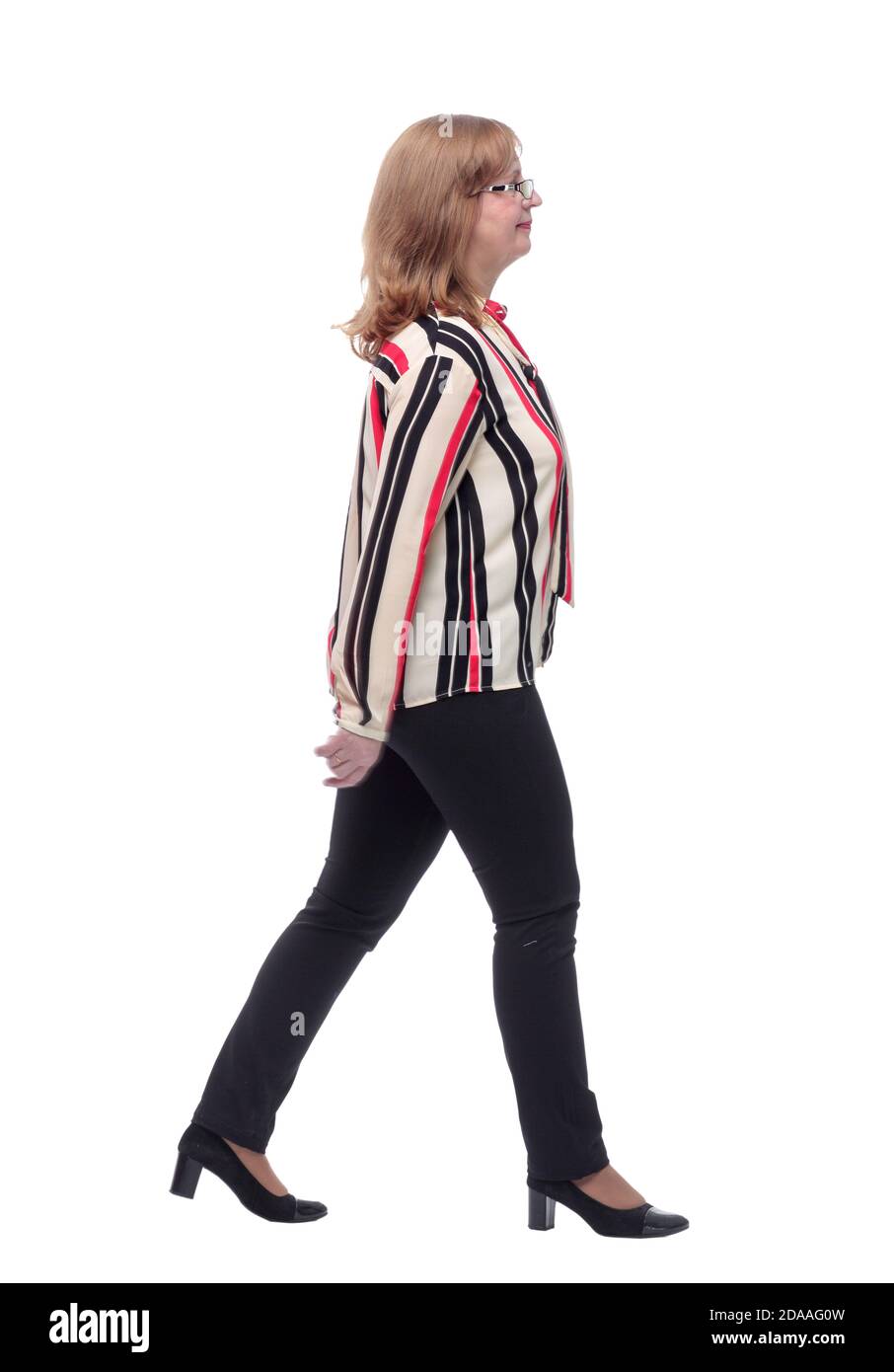 in full growth. smiling modern woman striding forward Stock Photo - Alamy