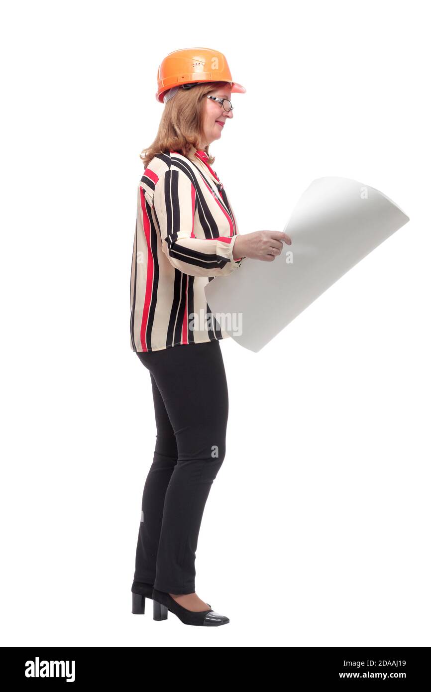 side view. smiling woman architect reading a drawing Stock Photo - Alamy