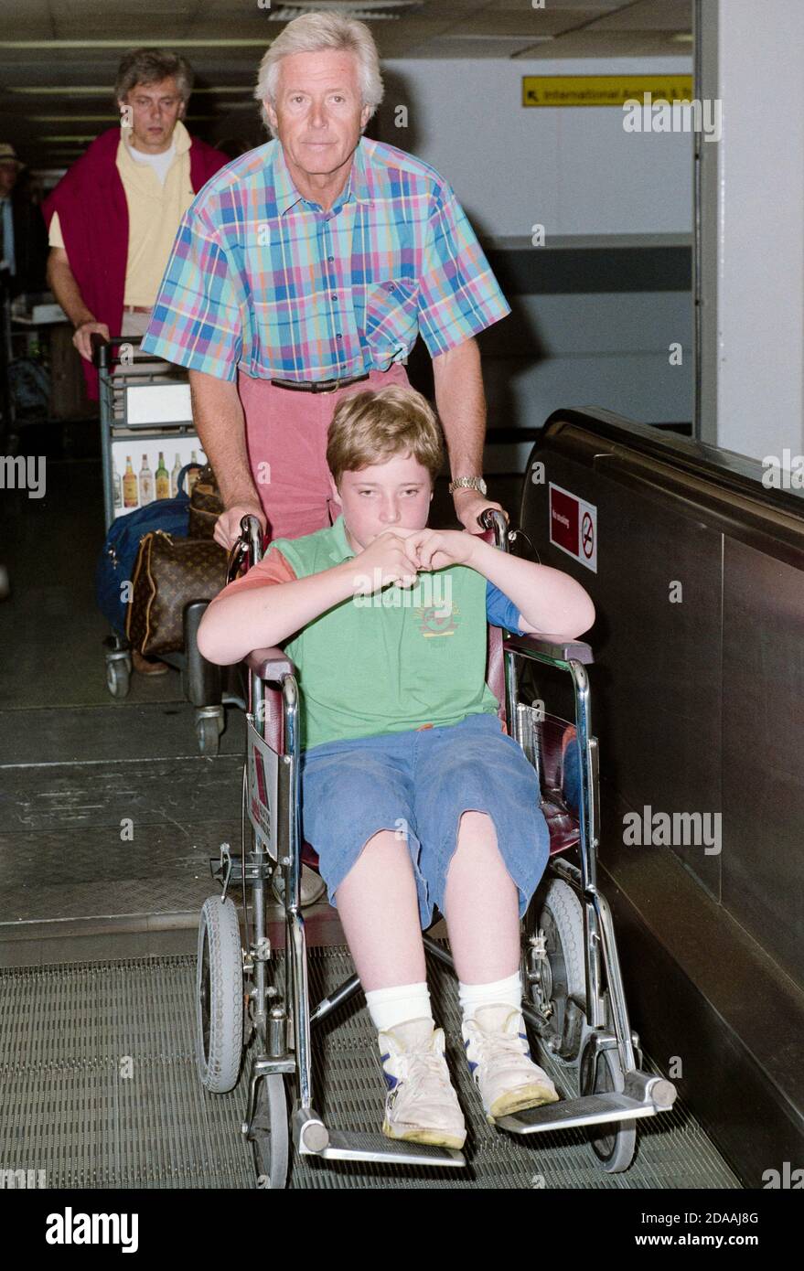TV presenter Michael Aspel and his disabled son Patrick at London ...