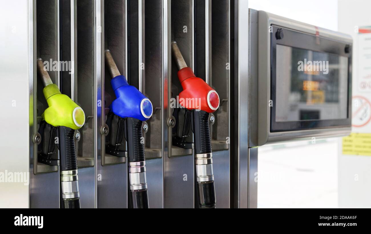 Gasoline column for refueling. Closeup guns for refueling at a gas ...