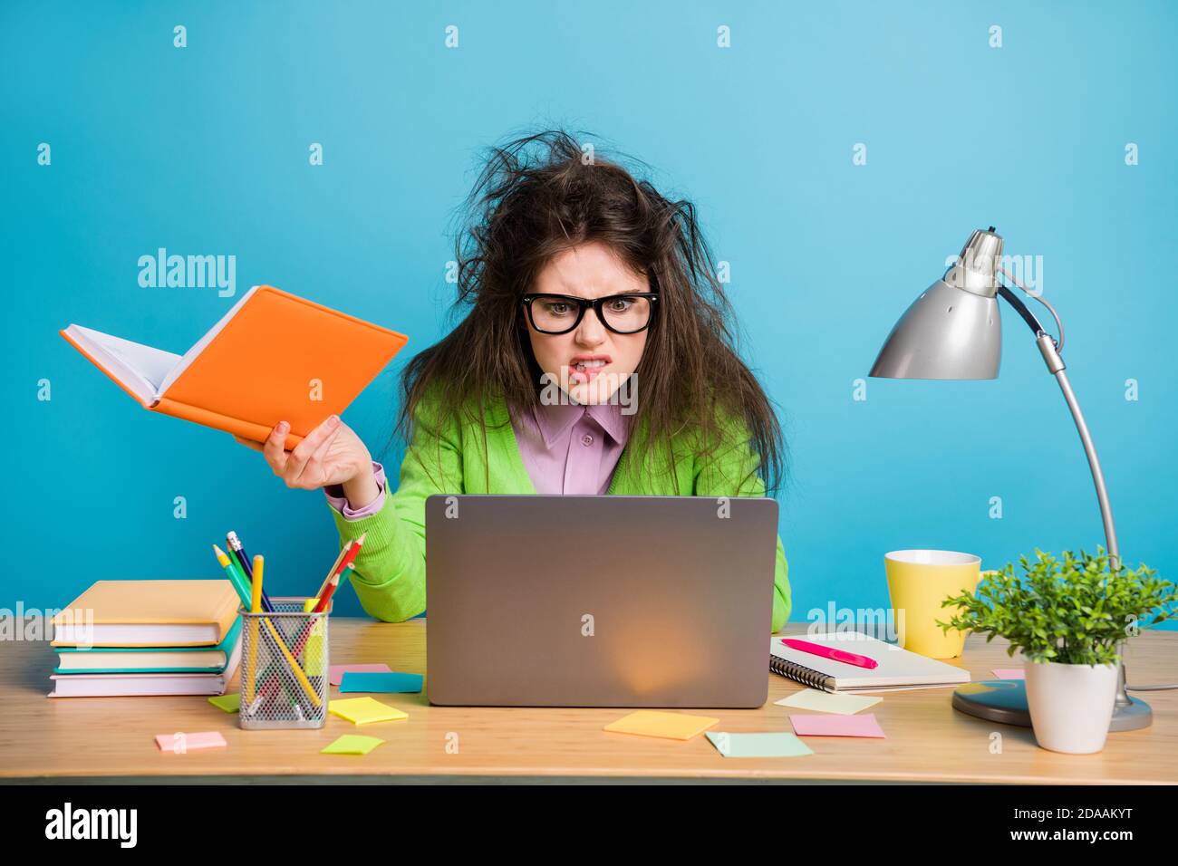 Portrait of nice attractive evil brunette girl doing homework watching ...