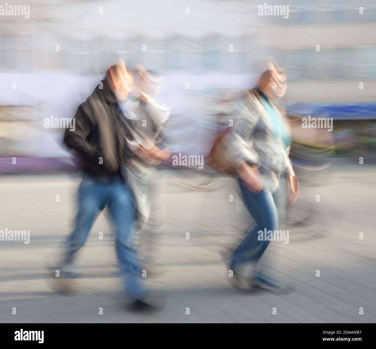 Young people going about their business. Street scene with intentional ...
