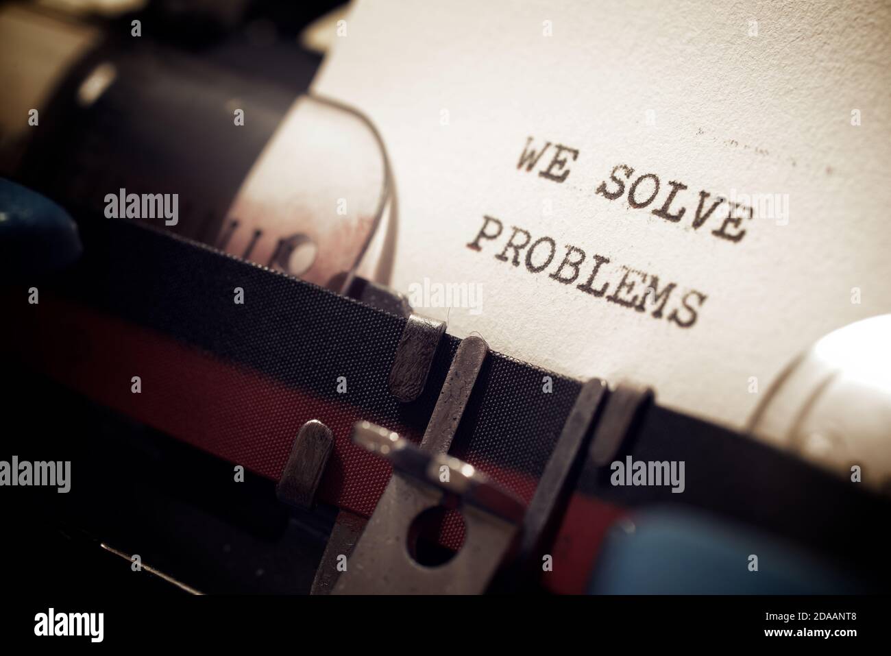 We solve problems phrase written with a typewriter Stock Photo - Alamy