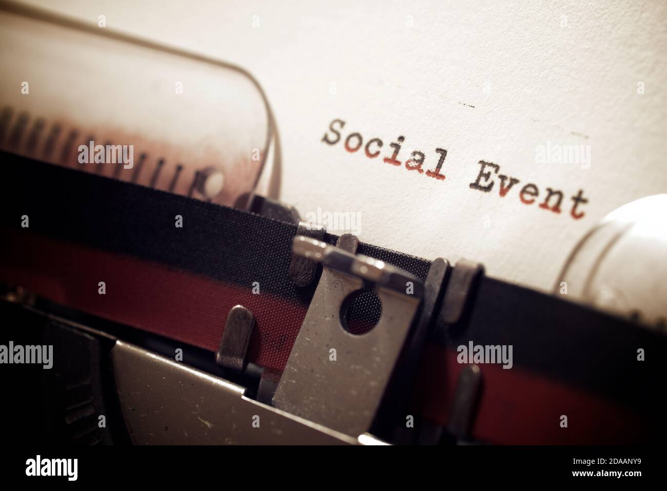 Social event phrase written with a typewriter Stock Photo - Alamy
