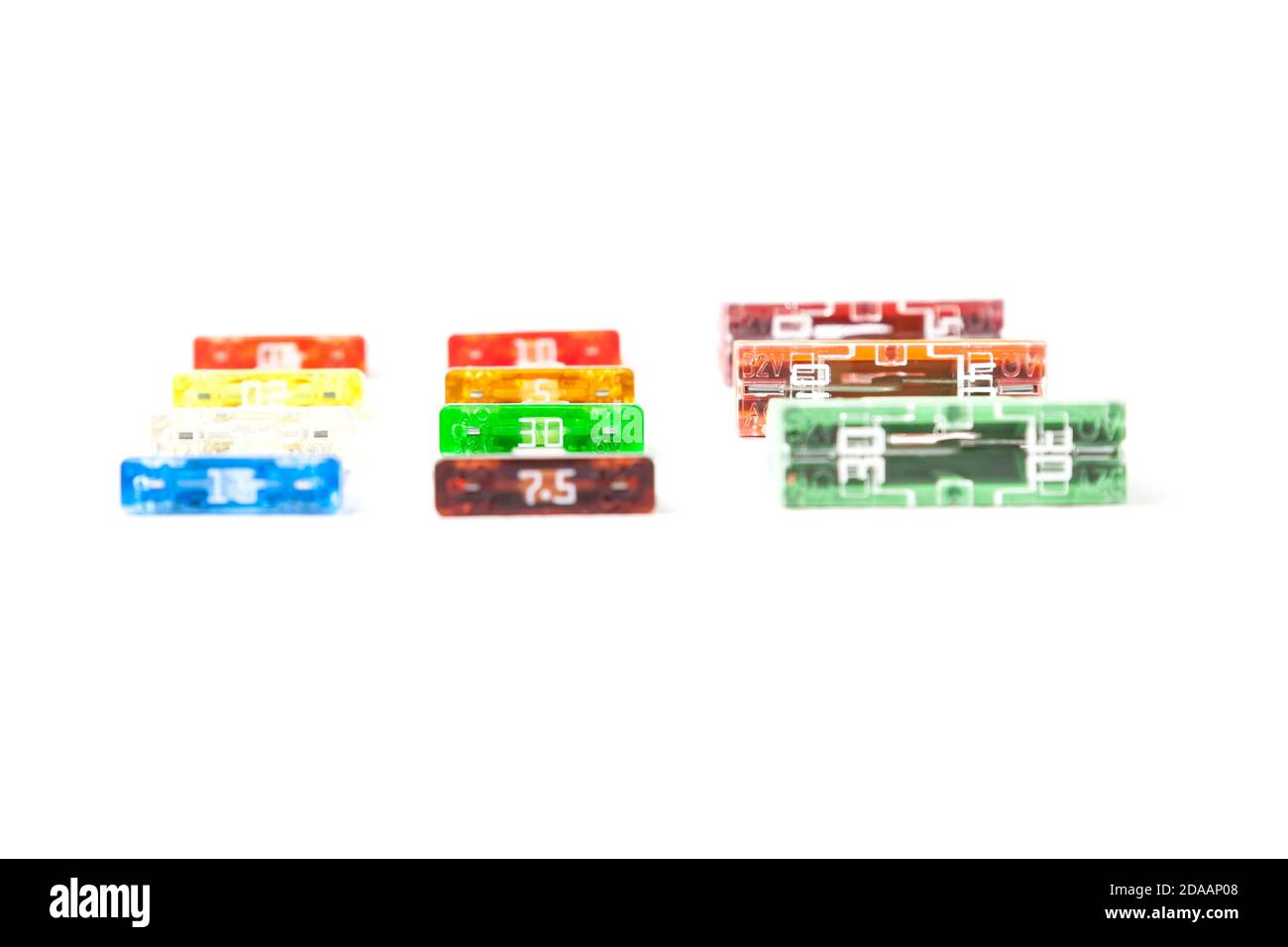 Colorful set of electronic fuses in yellow green orange red and blue on ...