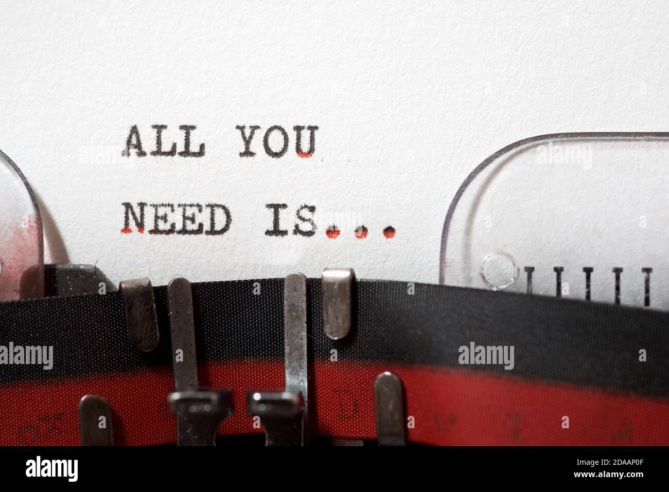 All you need is phrase written with a typewriter Stock Photo - Alamy