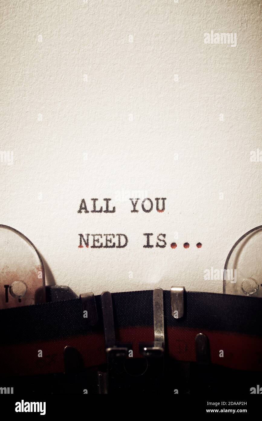 All you need is phrase written with a typewriter Stock Photo - Alamy