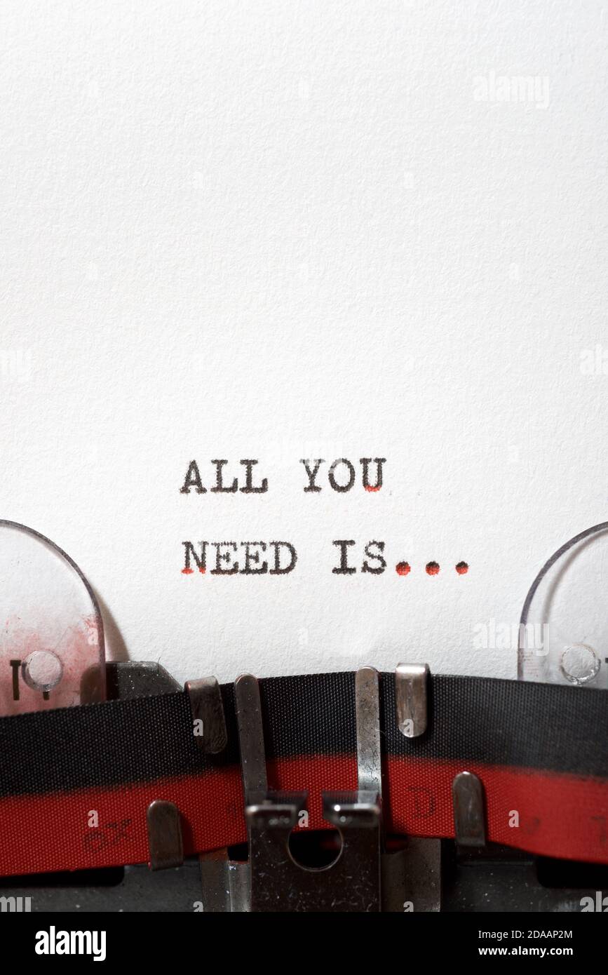 All you need is phrase written with a typewriter Stock Photo - Alamy