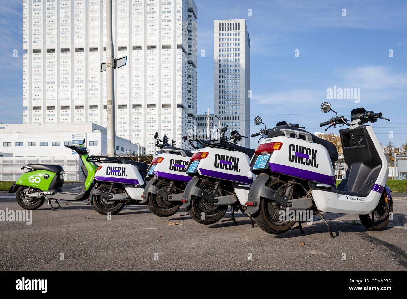 A Row of dockless electric scooters on the corner of a Rotterdam street ...