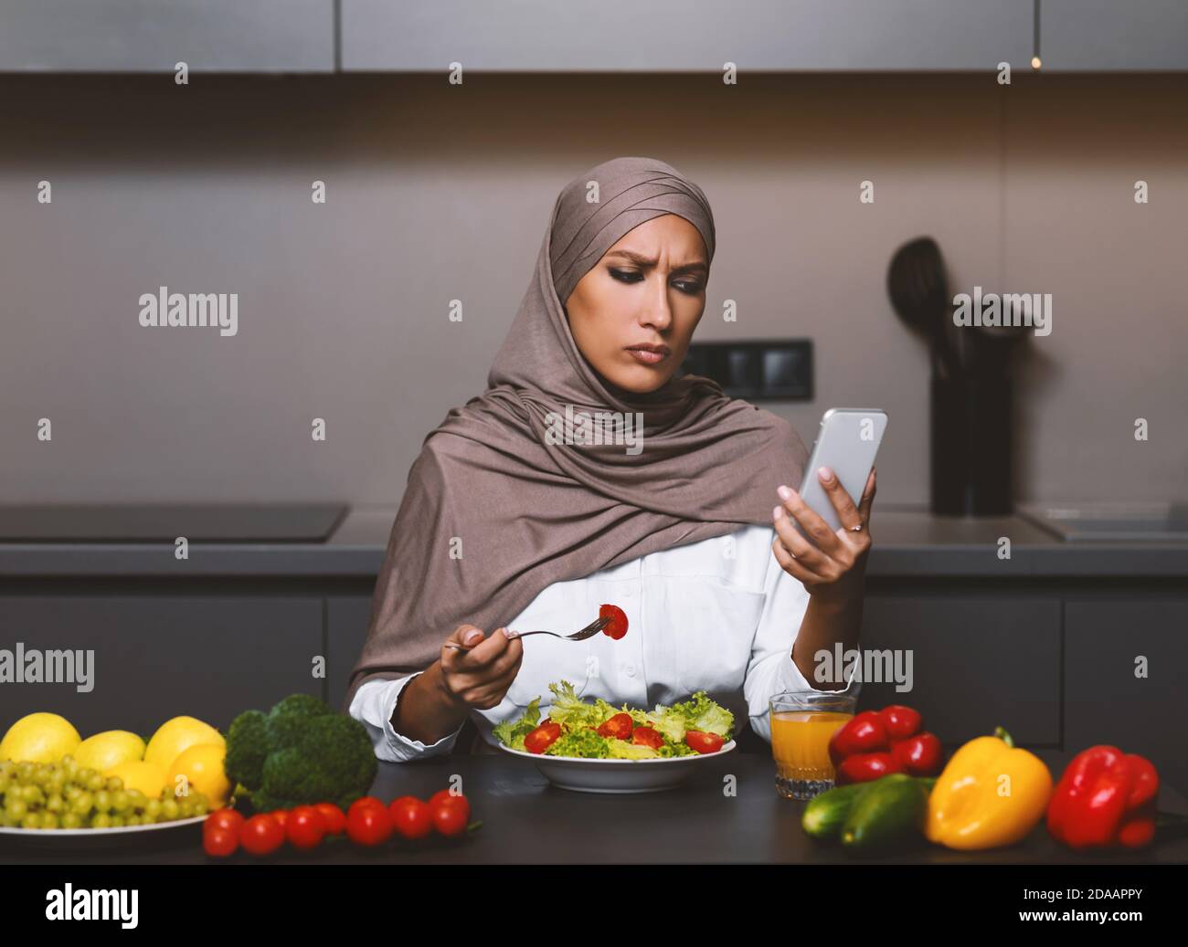 Sad woman eating salad hi-res stock photography and images - Alamy