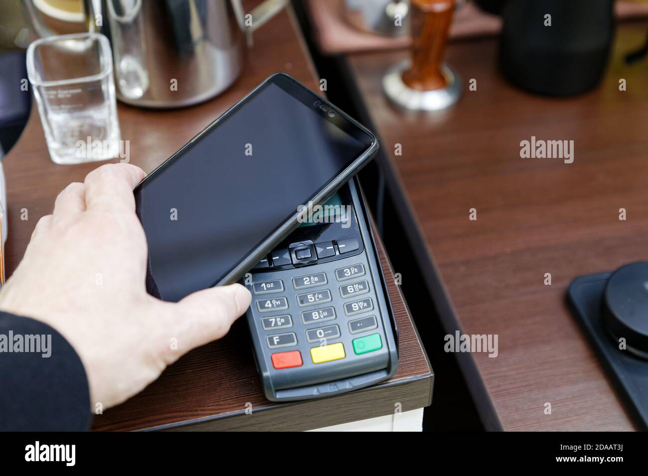 Contactless payment by phone with NFC technology in cafe, bar Stock ...