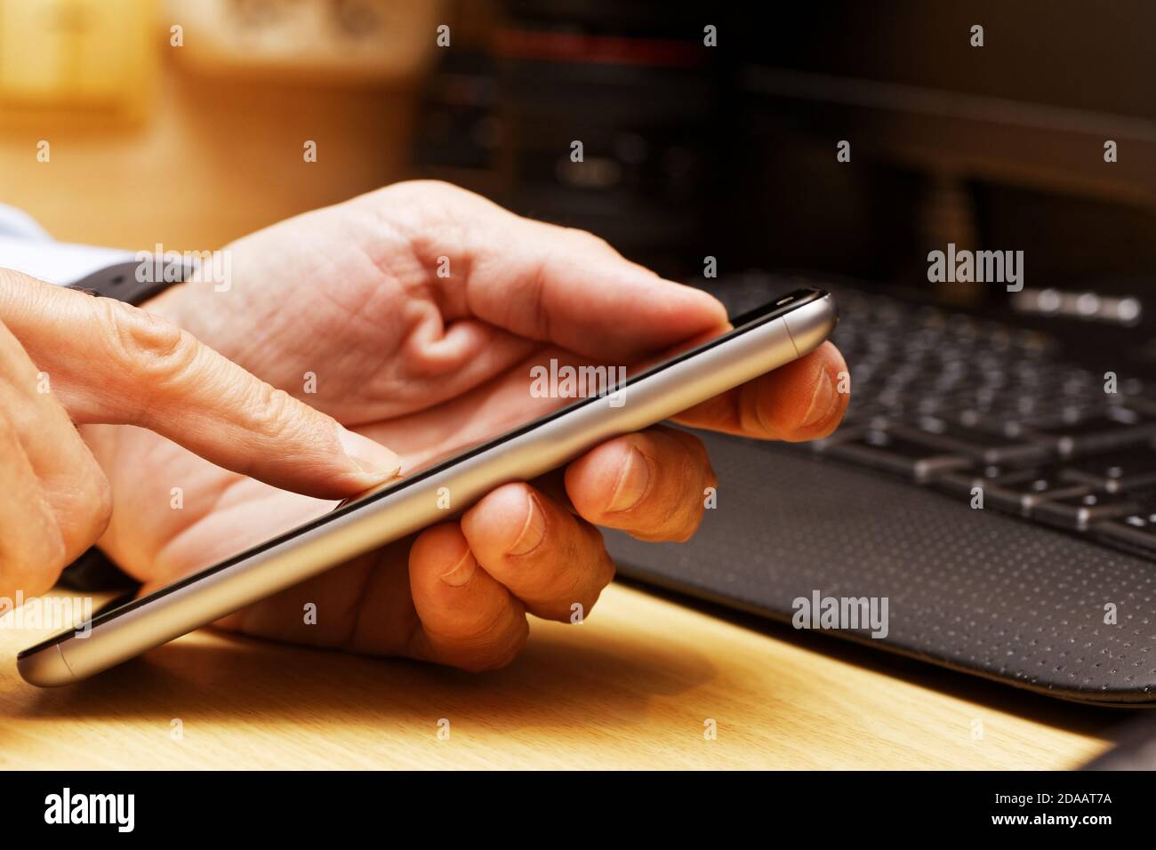 Human hands using smartphone. Finger swipe up and down the screen of ...