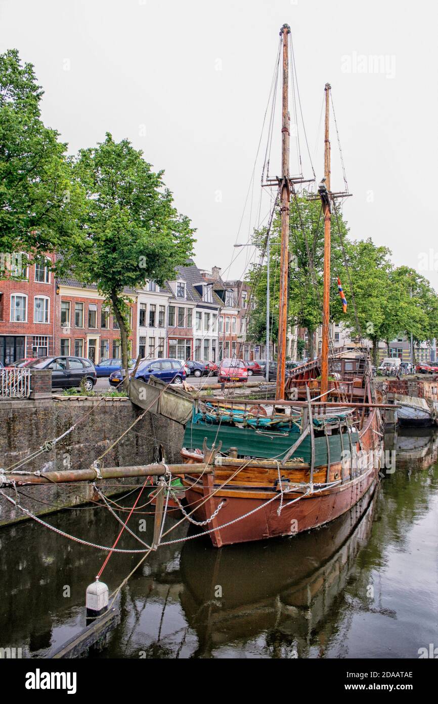 Warehouses and old sailing ships moored along Noorderhaven canal ...