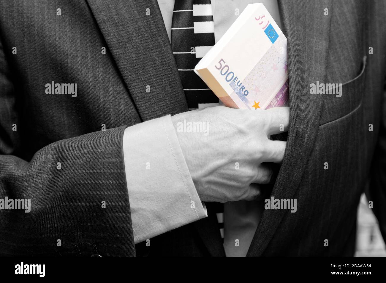 Man hides in a suit jacket pocket a bundle of banknotes 500 euros Stock ...