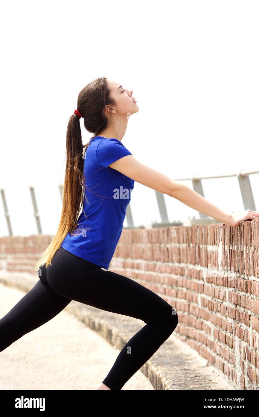Woman exercise pushing against wall hi-res stock photography and images ...