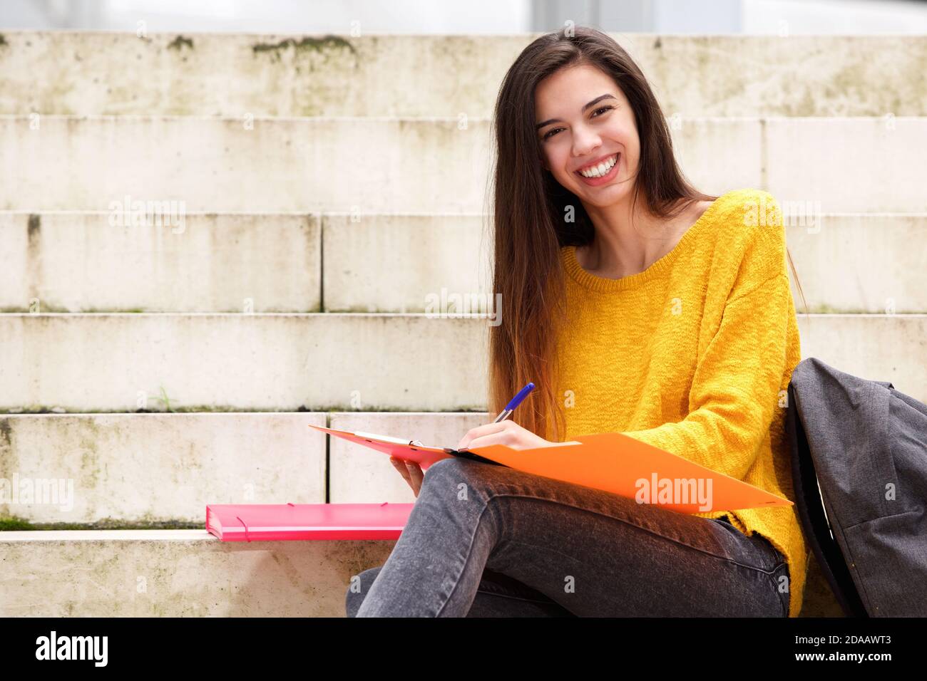 Portrait of smiling female student with notebook and pen Stock Photo ...
