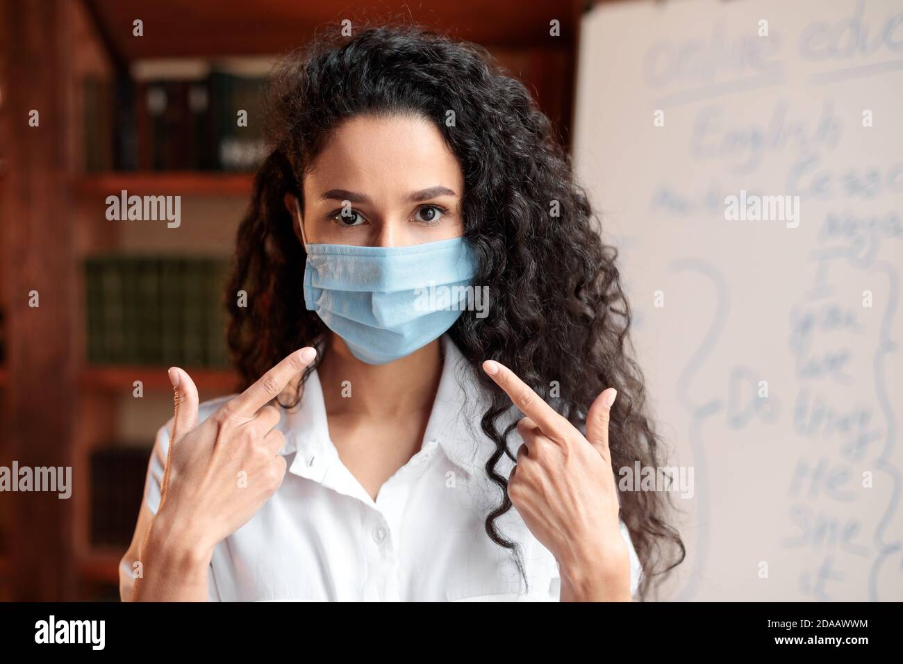Female teacher wearing mask hi-res stock photography and images - Alamy