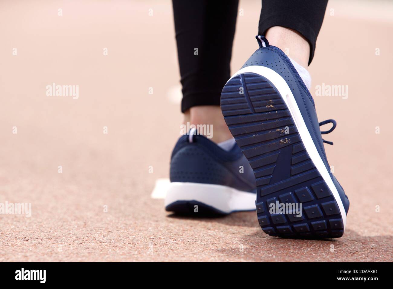 Close up portrait of sneakers on pavement Stock Photo - Alamy