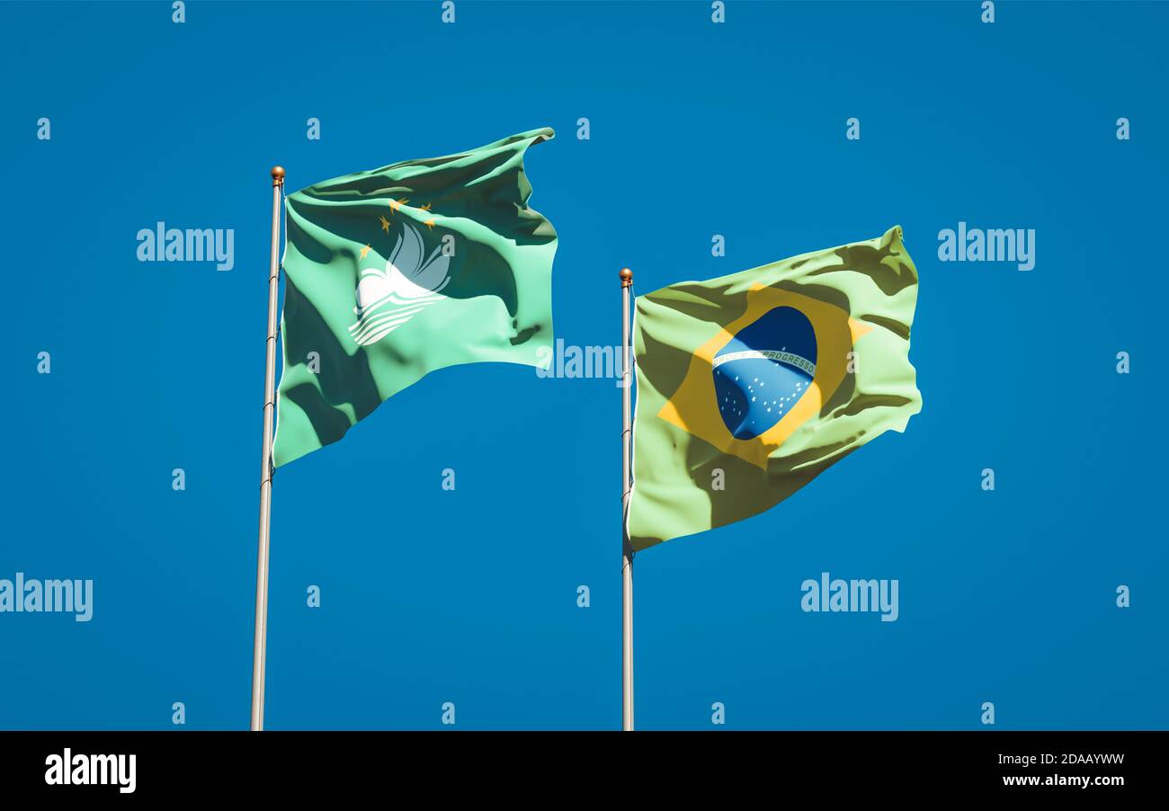 Beautiful national state flags of Macao and Brasil together at the sky ...