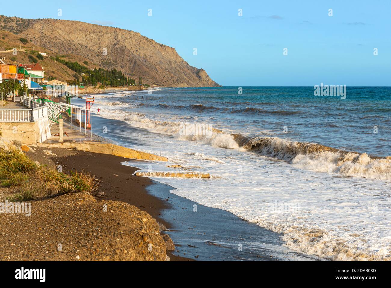 The sea is rough, the wind is blowing, the waves are rolling on a ...