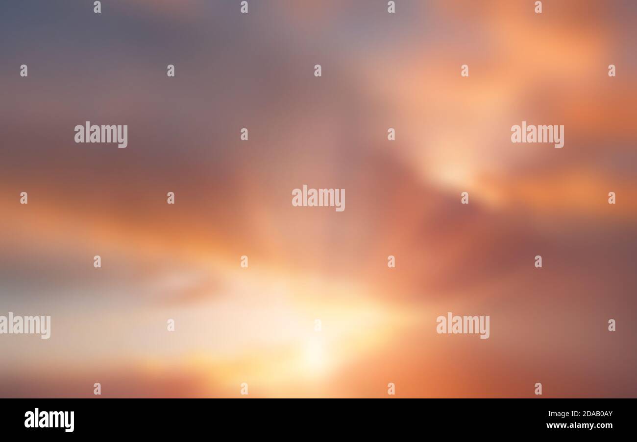 Blurred sunset cloudy sky background with sunrays Stock Photo - Alamy