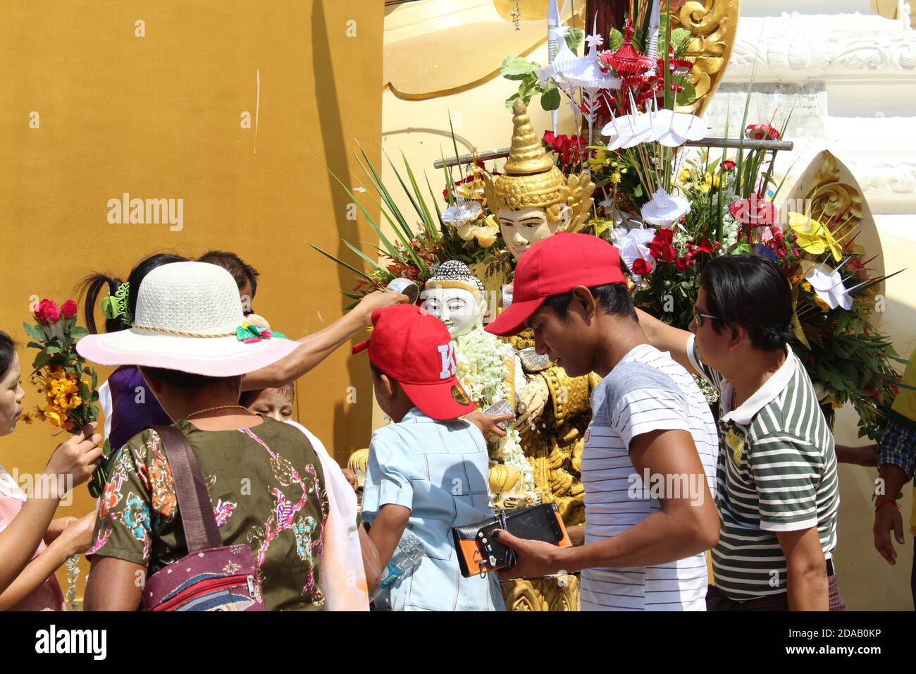 Burmese people at the Shwedagon pagoda in Yangon, Myanmar / Rangoon ...