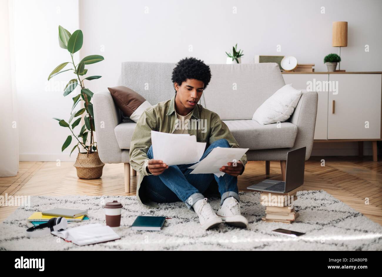 Home education concept. Black teen student making educational project ...