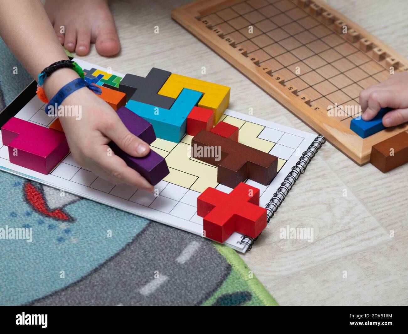 Children play a Board game. Educational games for children. the ...