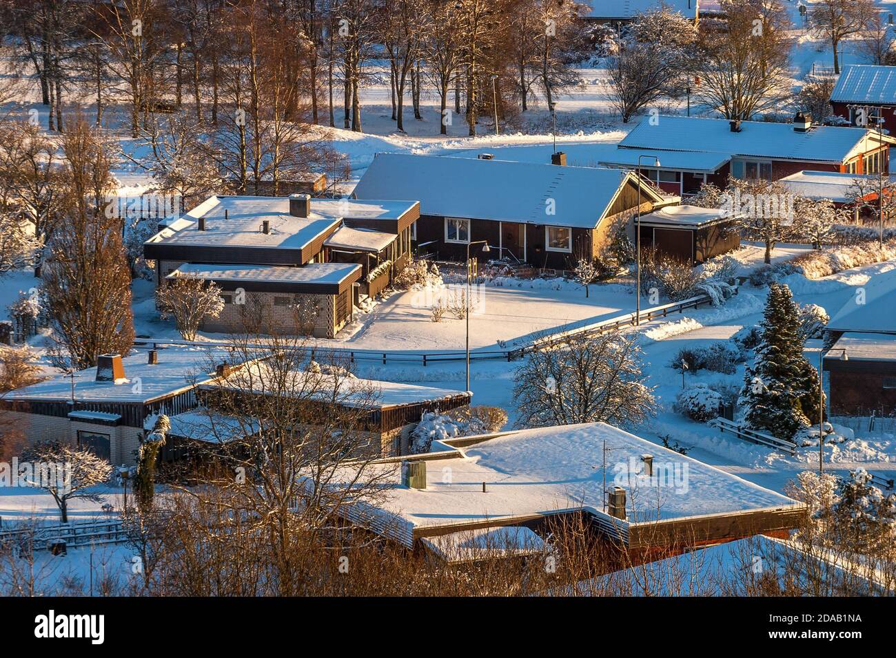 Detached houses in winter with snow Stock Photo - Alamy