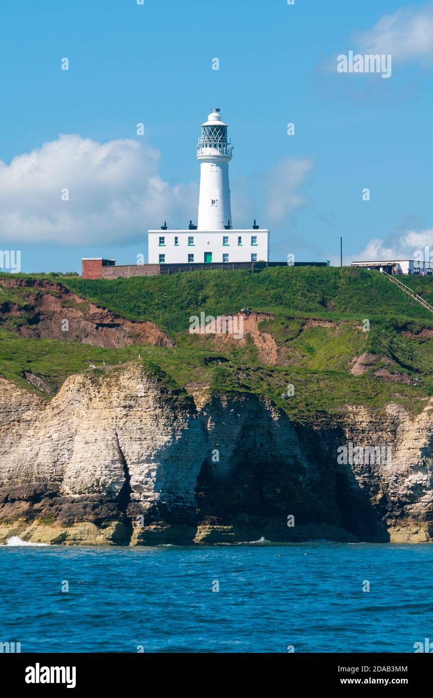 The Flamborough Head Lighthouse above the chalk cliffs as seen from the ...