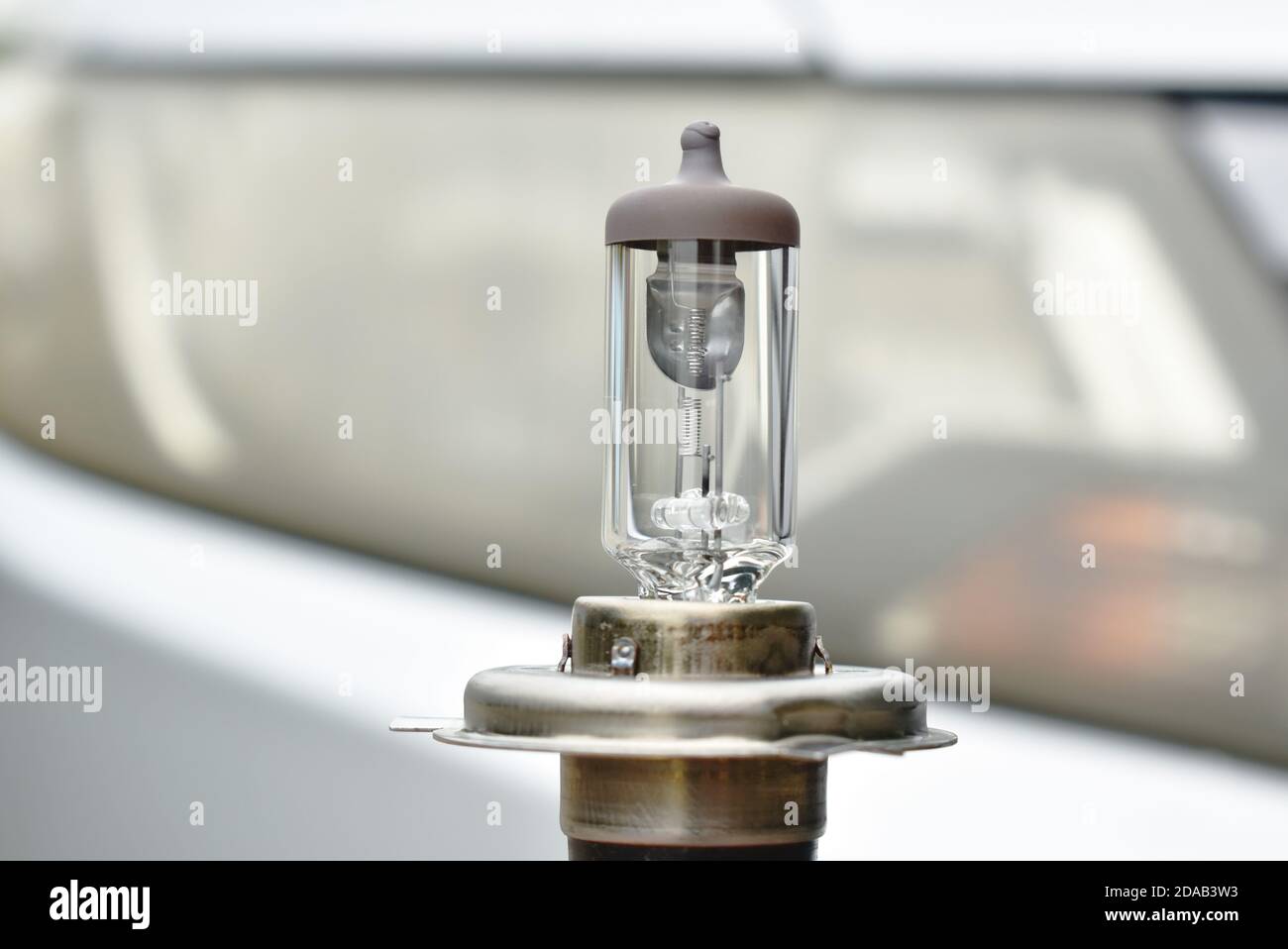 halogen light bulb vehicle spare parts on car head lamp background ...