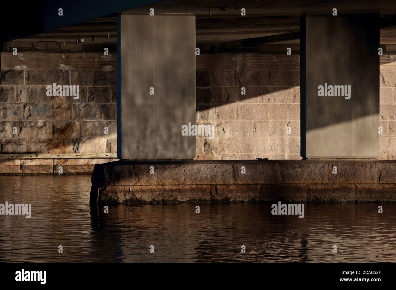 Concrete columns of a bridge over a lake Stock Photo - Alamy