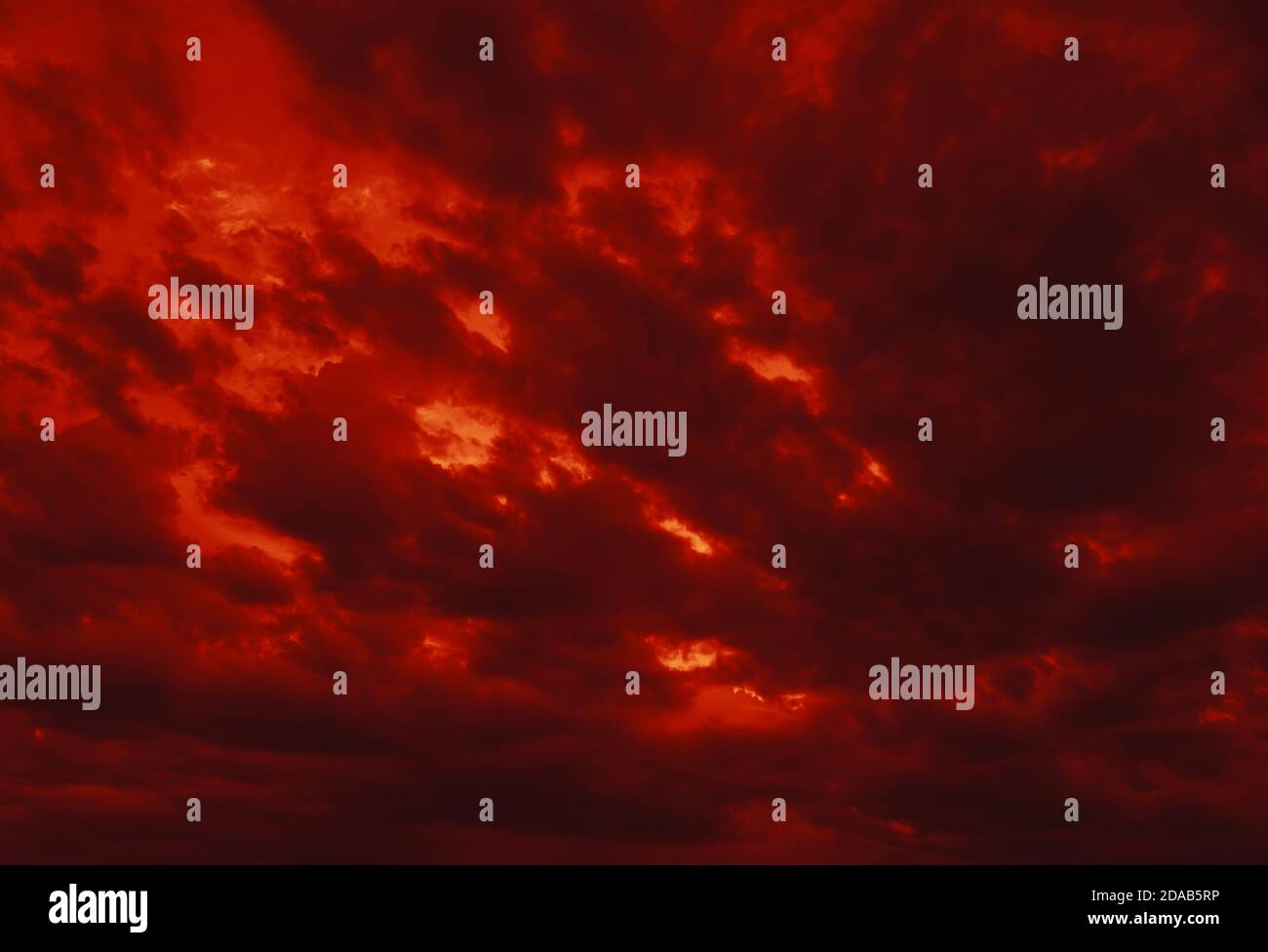 Nature background. Dramatic red clouds on the sky Stock Photo - Alamy