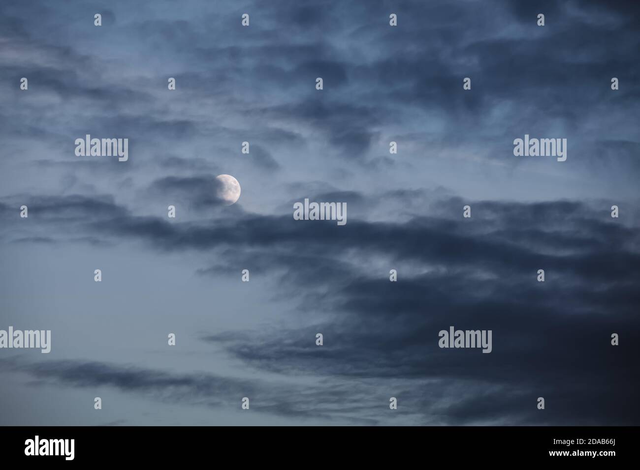 Evening sky with clouds and moon Stock Photo - Alamy