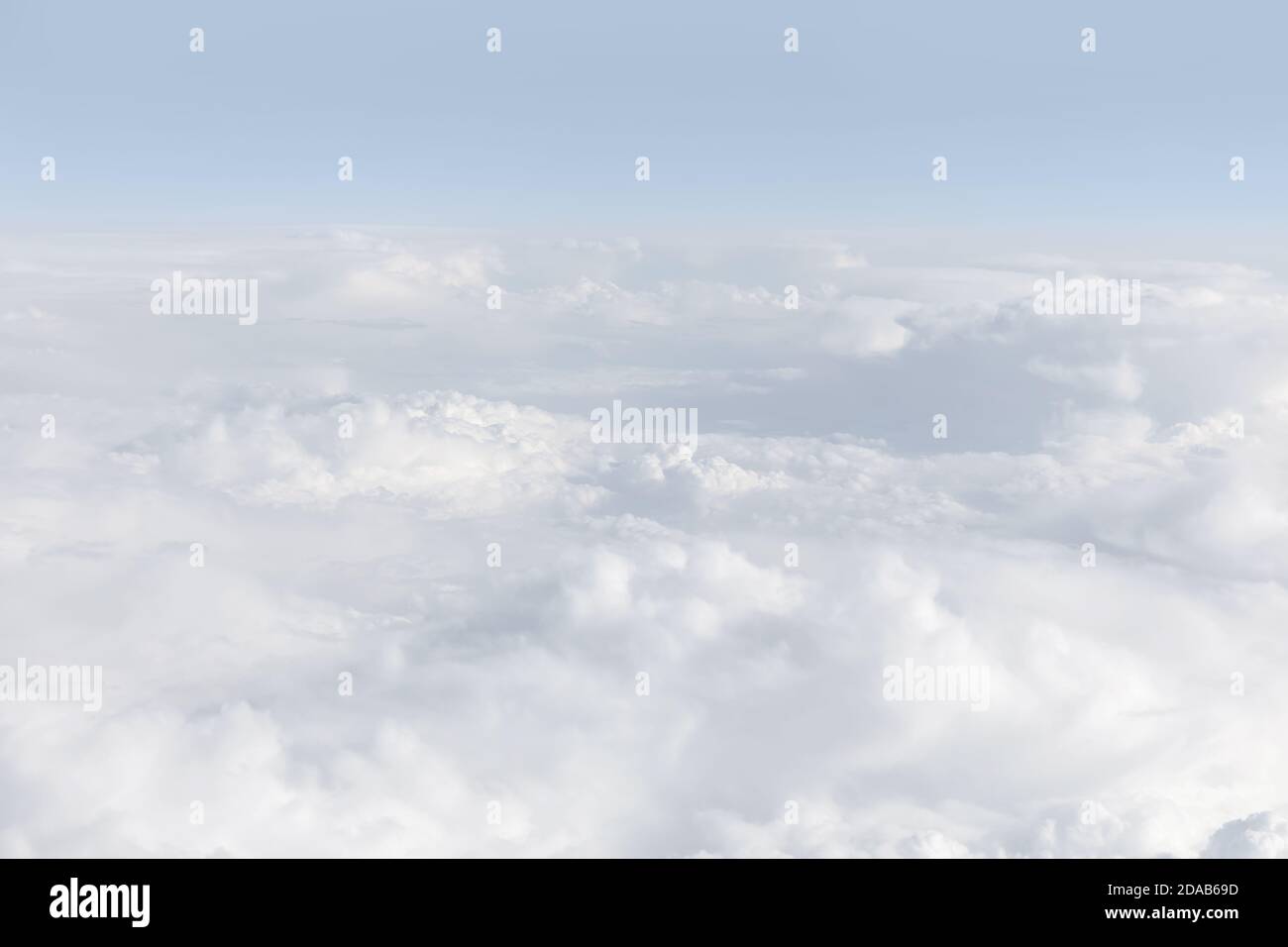 Sky with clouds, a view from an aeroplane above the clouds. Abstract ...