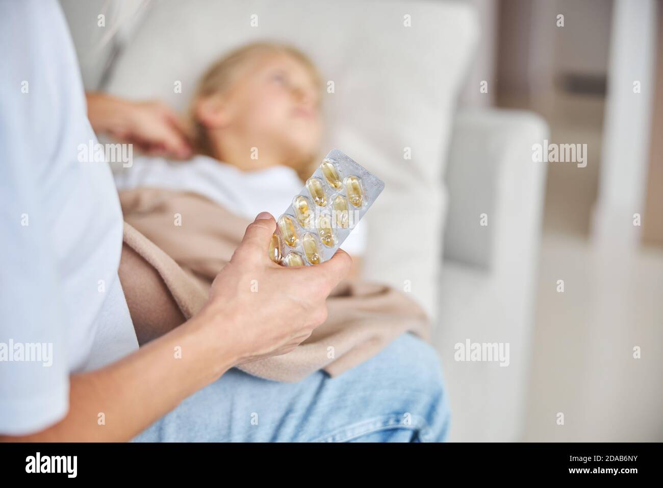 Smart mother taking care for her female child in home apartment Stock ...
