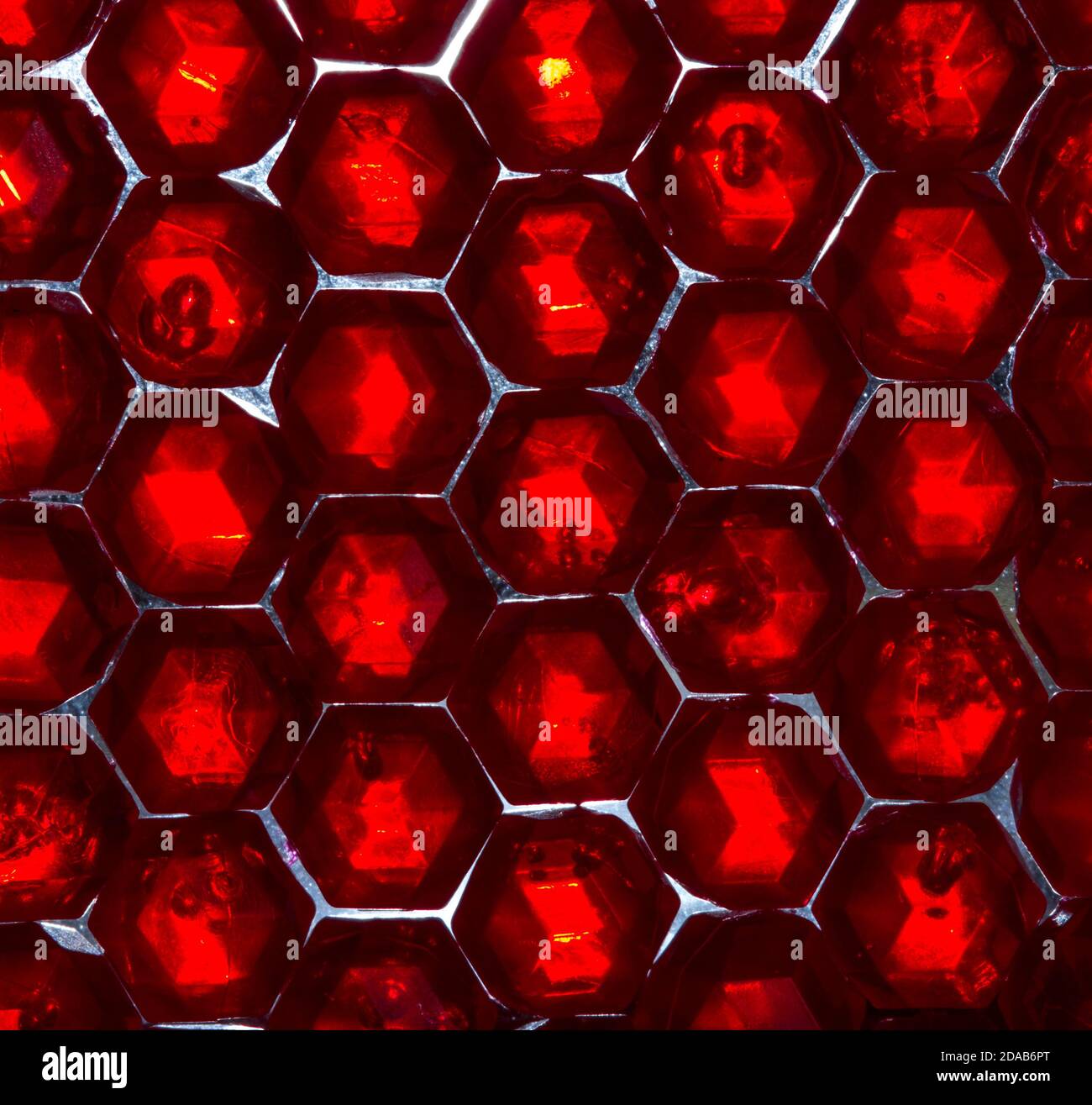 Close up of translucent red crystals. Red beads glittering and shining ...