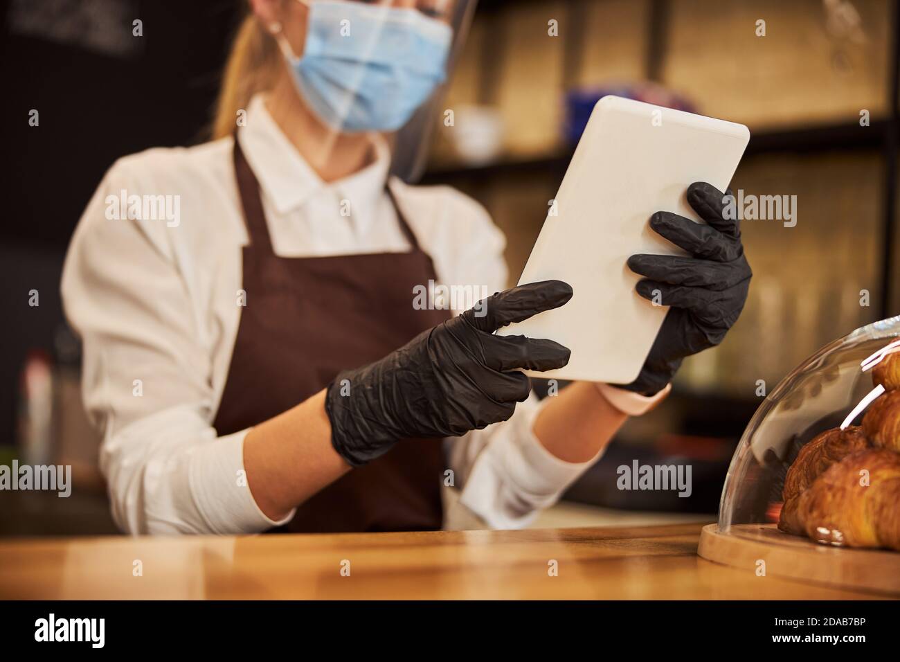 Modern device used in the coffee house by the waitress Stock Photo - Alamy