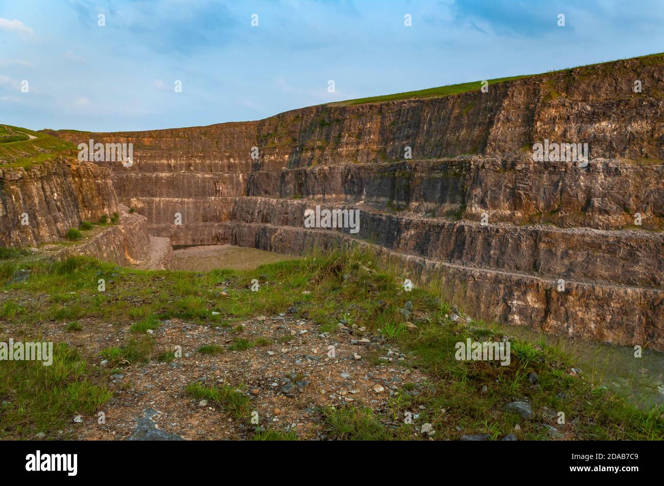 Steep benches of excavated limestone in the abandoned Eldon HIll Quarry ...