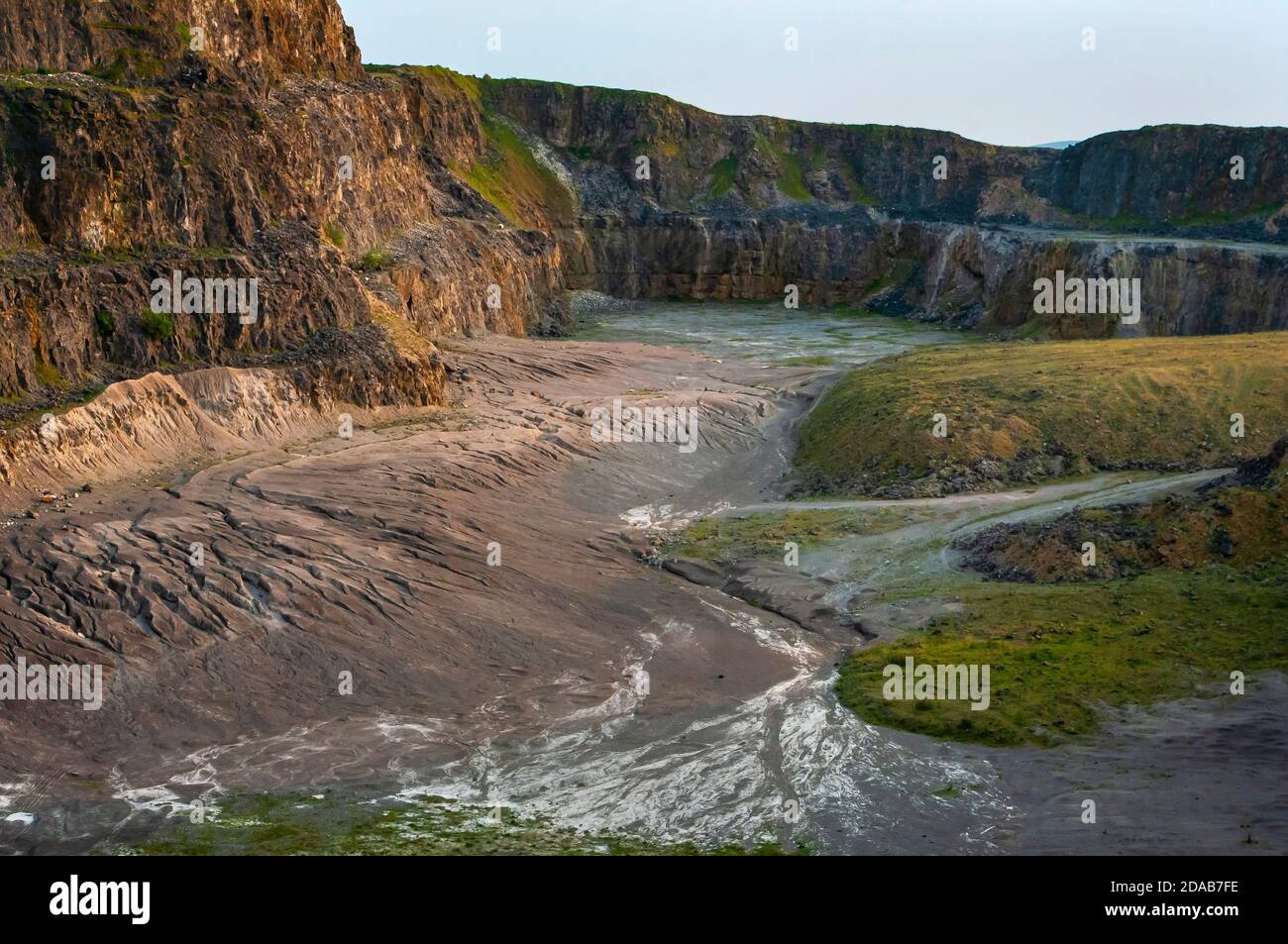 Steep benches of excavated limestone in the abandoned Eldon HIll Quarry ...
