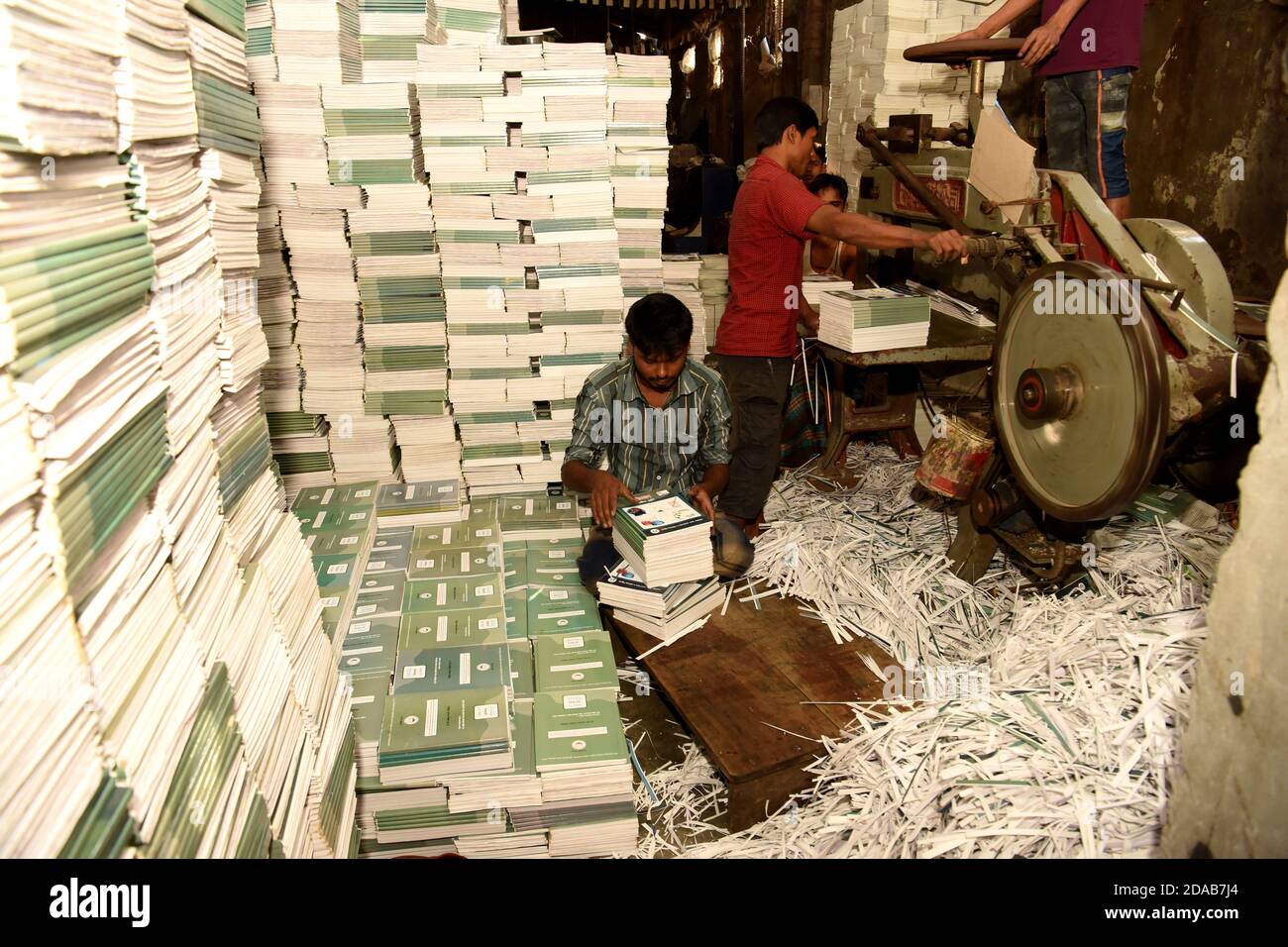 Bangladeshi worker works in a book binding factory in Dhaka City in ...