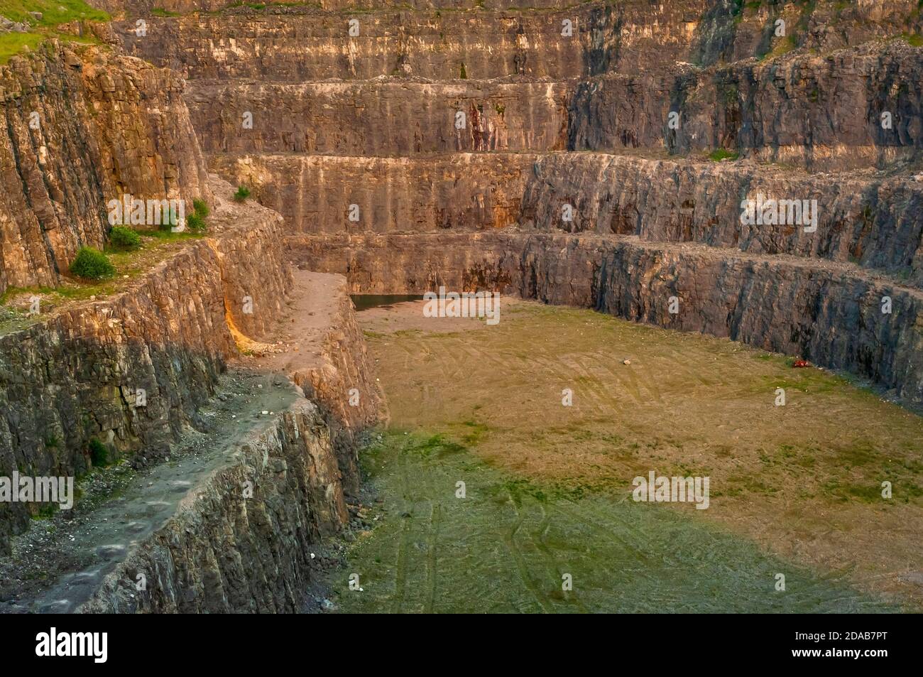 Steep benches of excavated limestone in the abandoned Eldon HIll Quarry ...